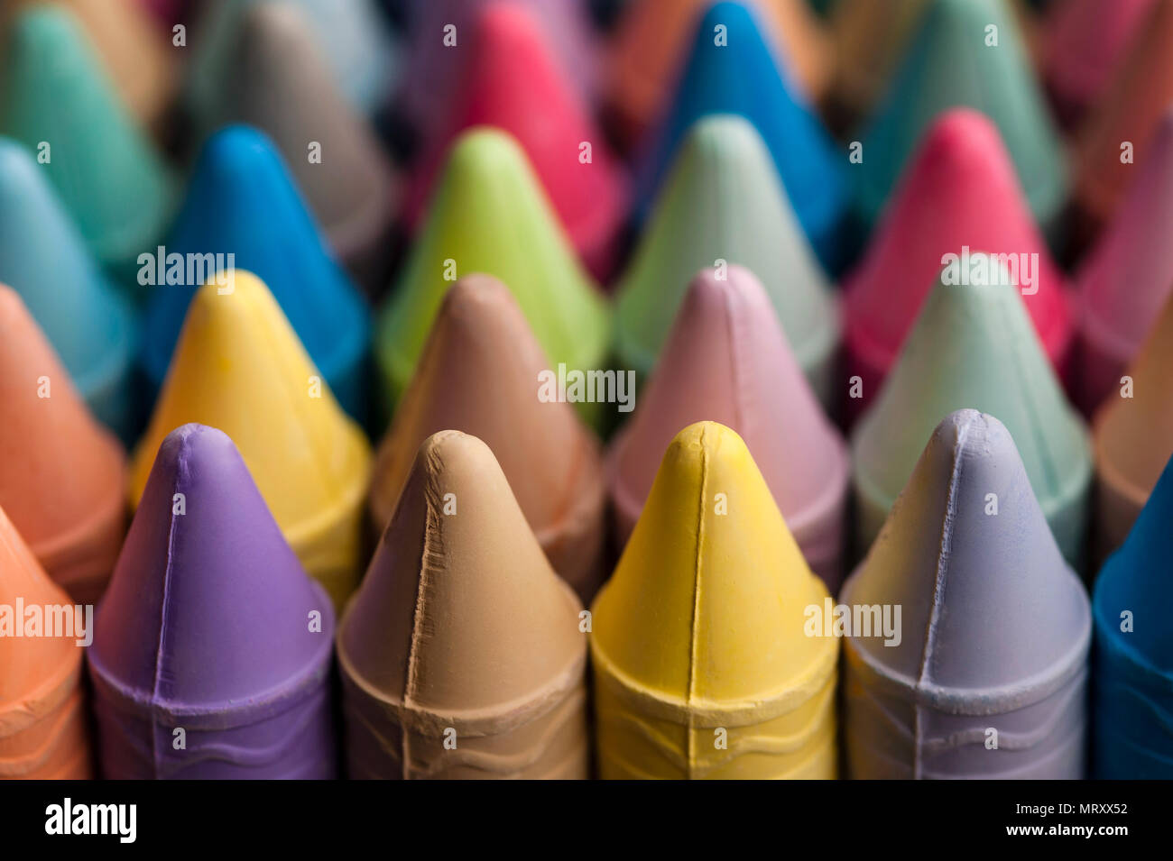 Multicolored colored chalk in rows creating interesting color patterns ...