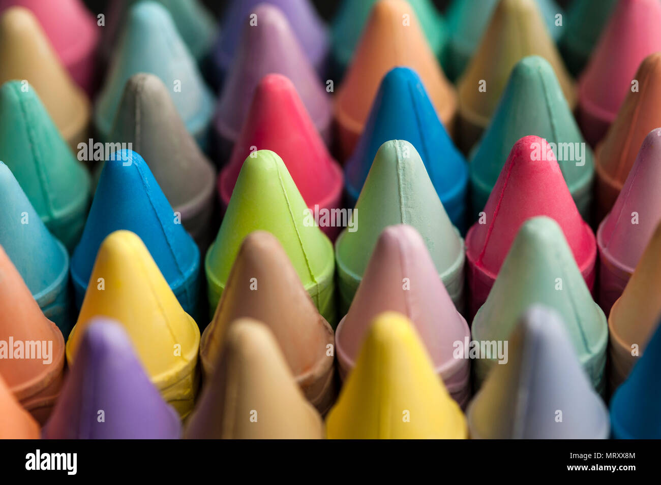 Multicolored colored chalk in rows creating interesting color patterns ...