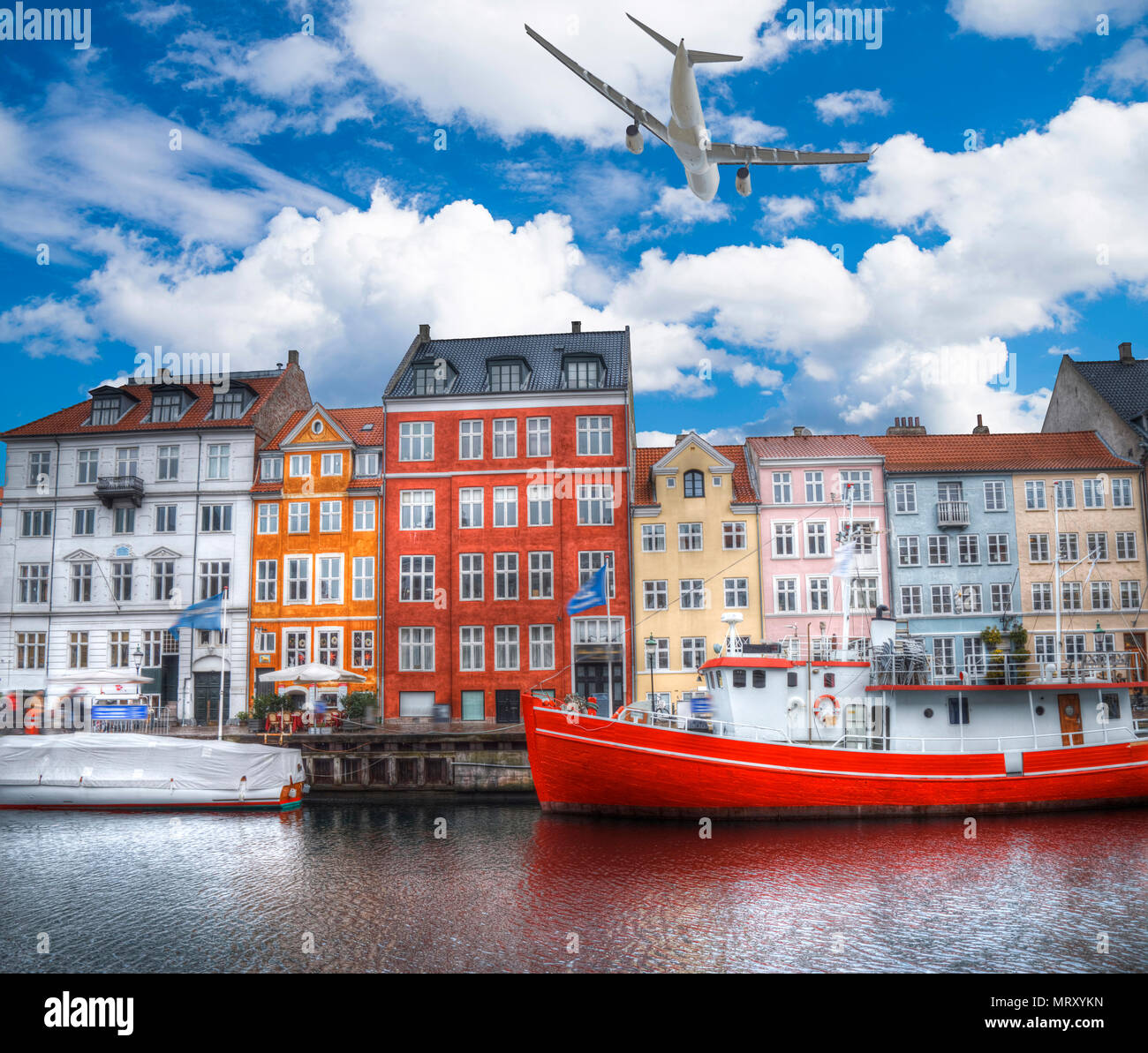 the plane is flying over Nyhavn is the old harbor of Copenhagen ...