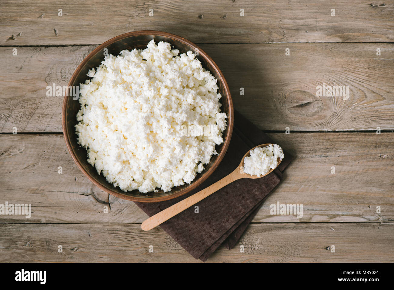 Cottage cheese, curd on rustic wooden table, top view, copy space ...