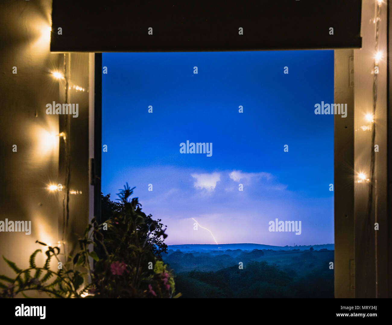Lightning bolt in stormy view through cabin window in the country Stock ...