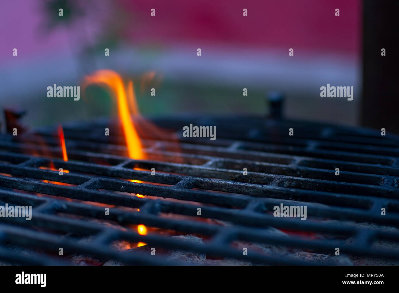Barbecue empty grill with shimmering coal and bright flames Stock Photo ...