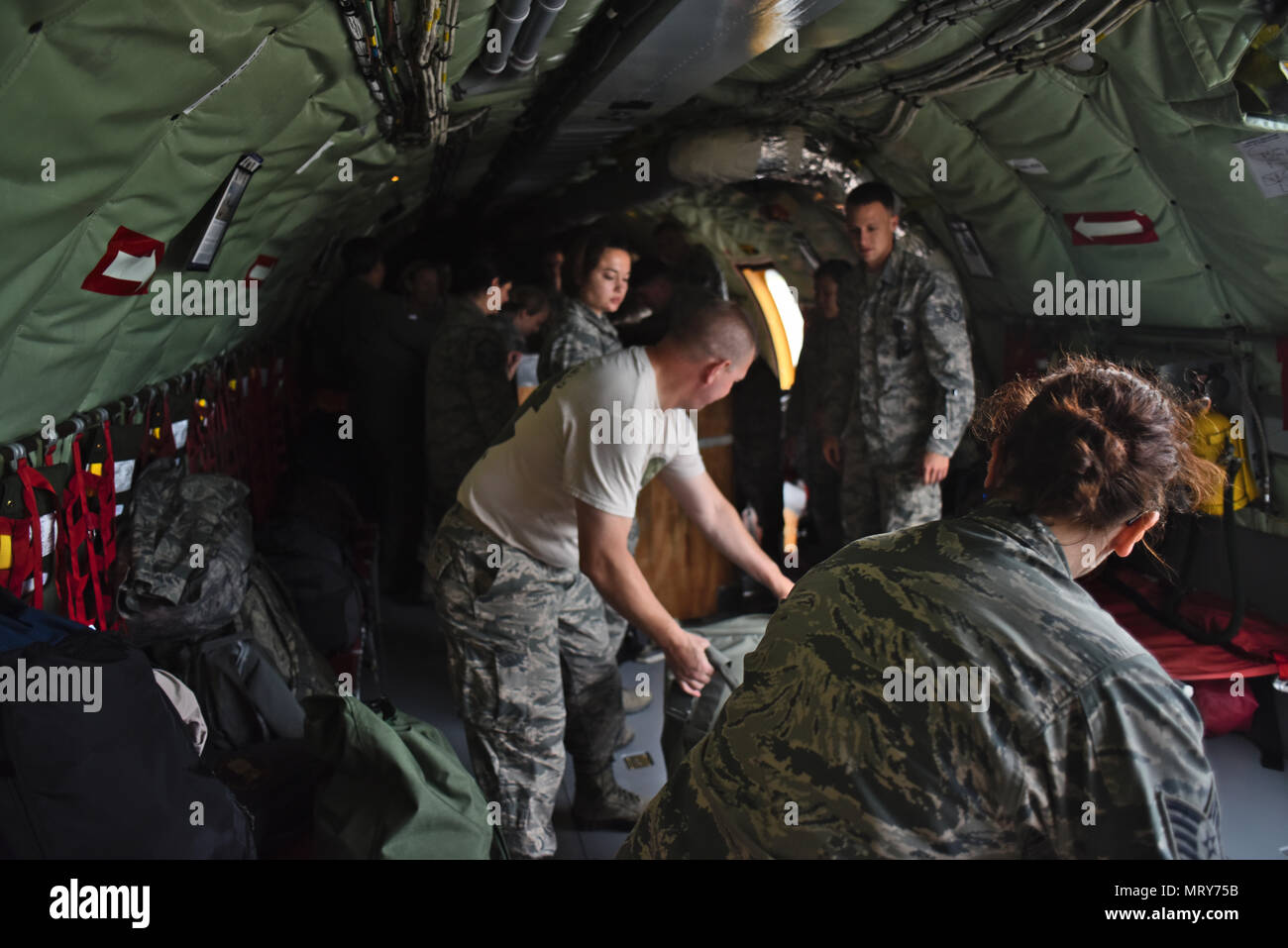 Members of the 126th Medical Group, load their luggage and professional ...