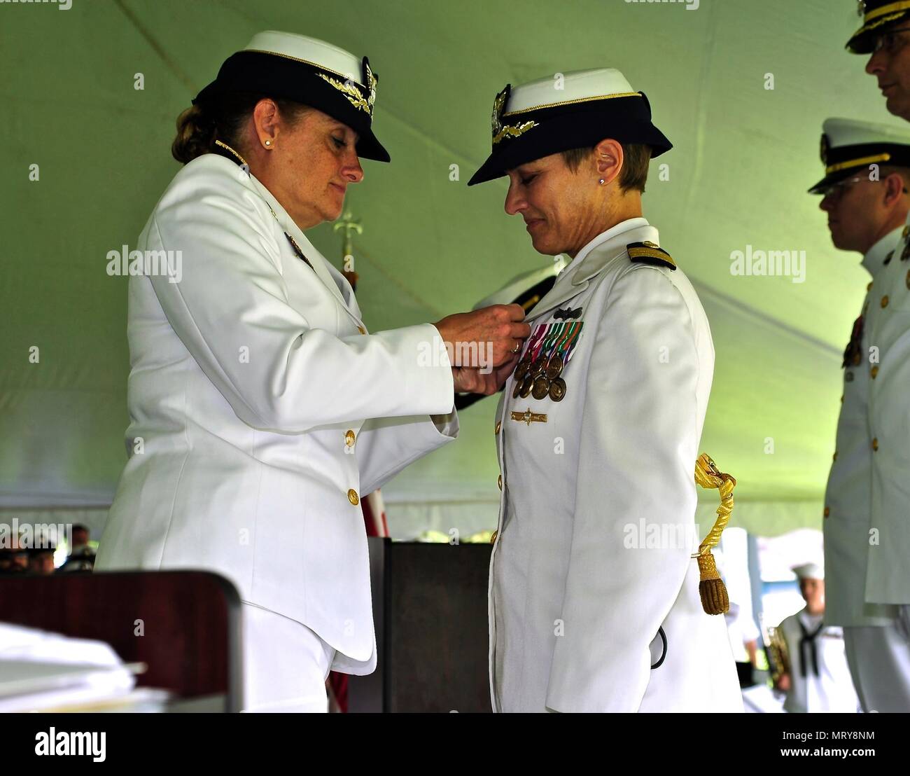 Rear Adm. June Ryan, commander, Ninth Coast Guard District, presents ...