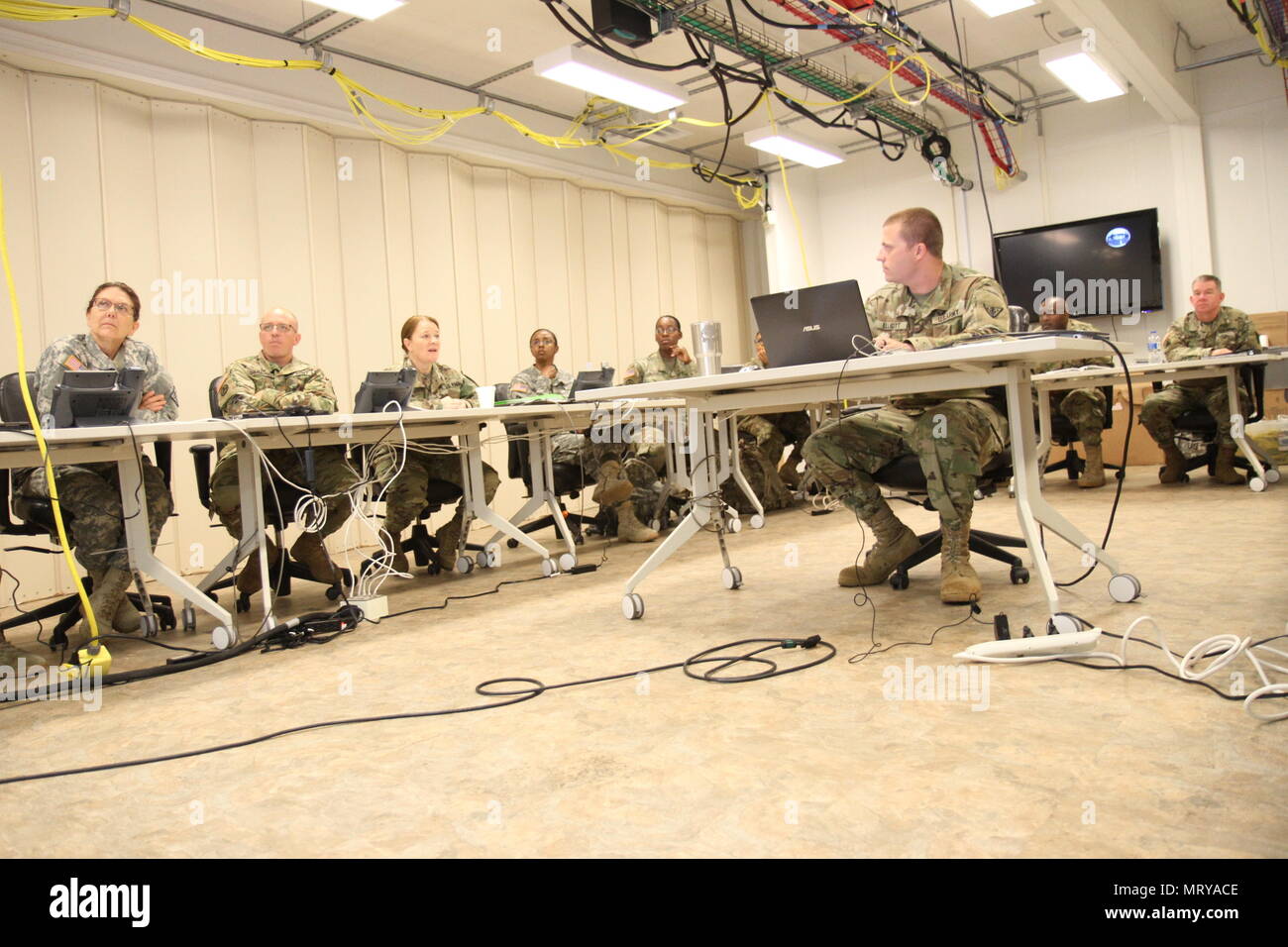 1Lt. Elliott (center) receives input from 3d MCDS soldiers ...