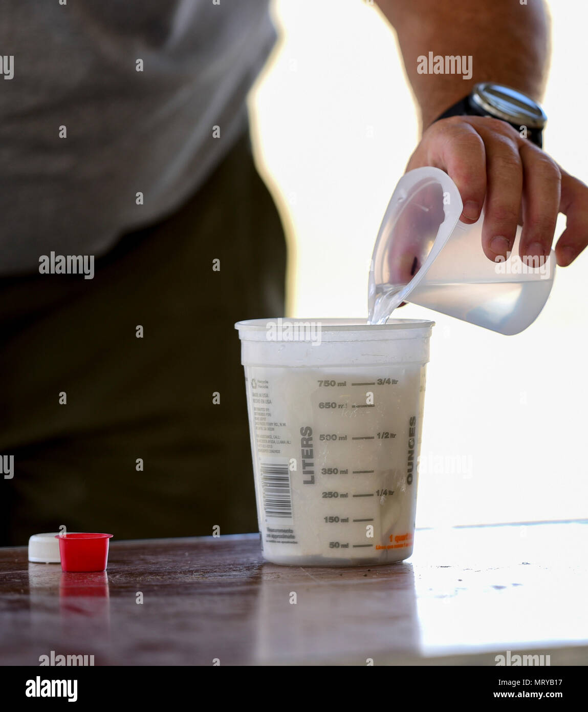 An FBI Special Agent Bomb Technician prepares a homemade explosive ...