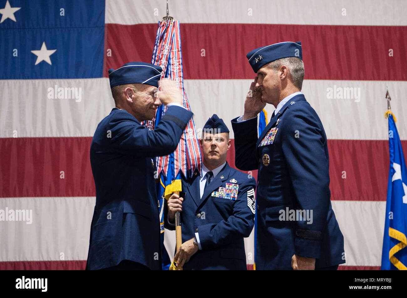 Gen. Mike Holmes, commander of Air Combat Command, exchanges a salute ...