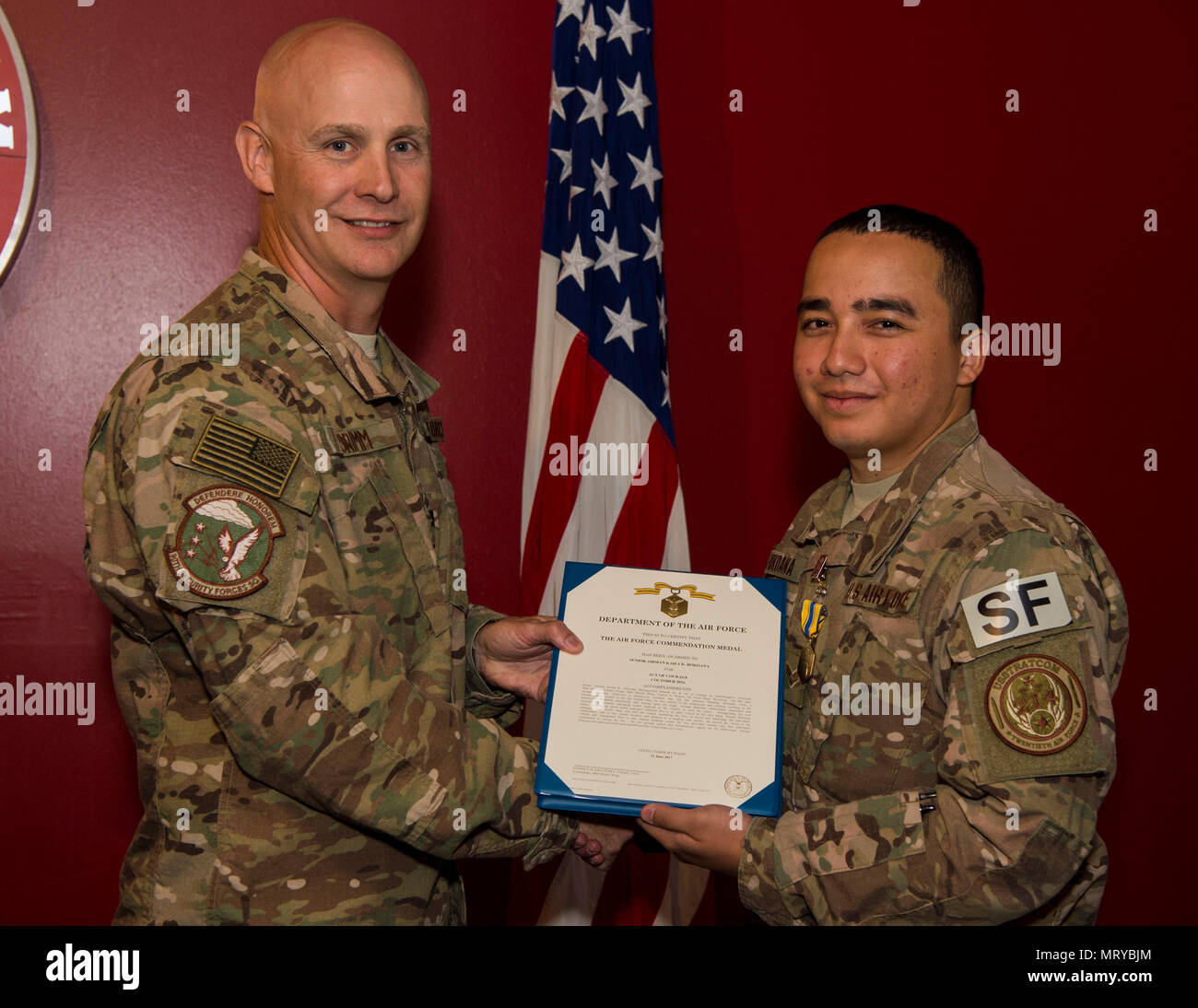 Col. John Grimm, 90th Security Forces Group commander, presents Senior ...