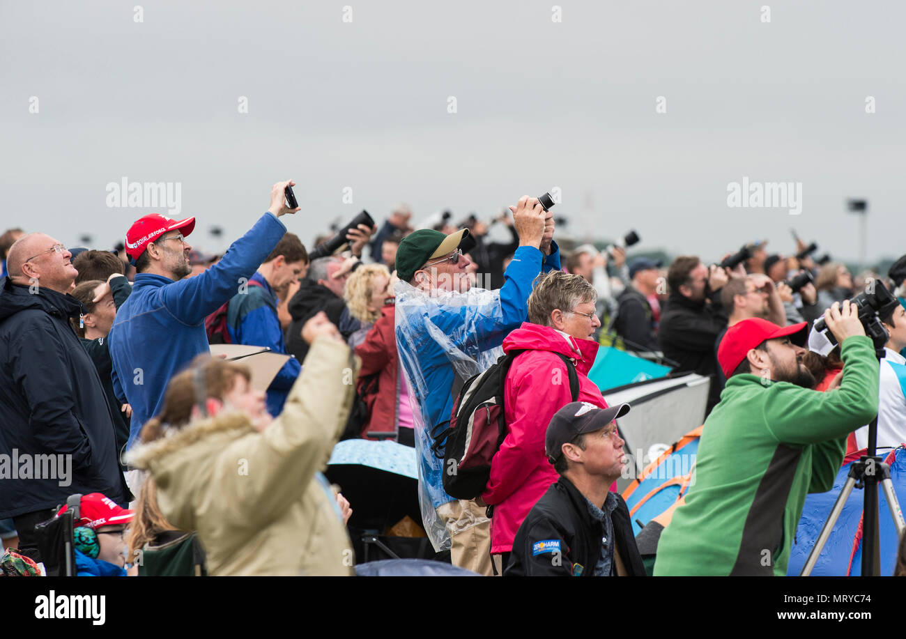 FAIRFORD, United Kingdom – Spectators take photos of aircraft during ...