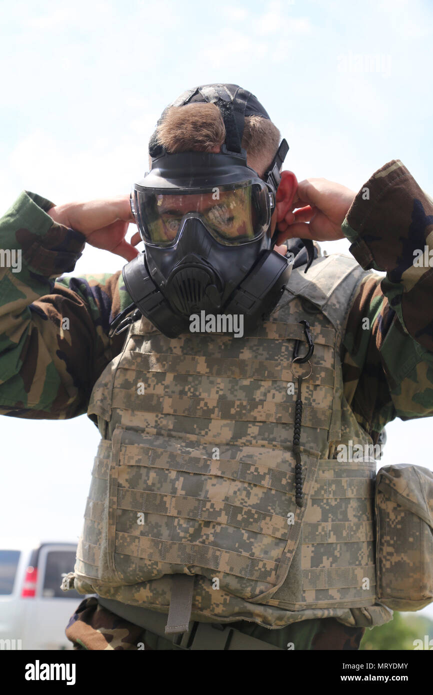 U.S. Army Sgt. Andrew Roland, 71st Ordnance Group (EOD), puts on his ...