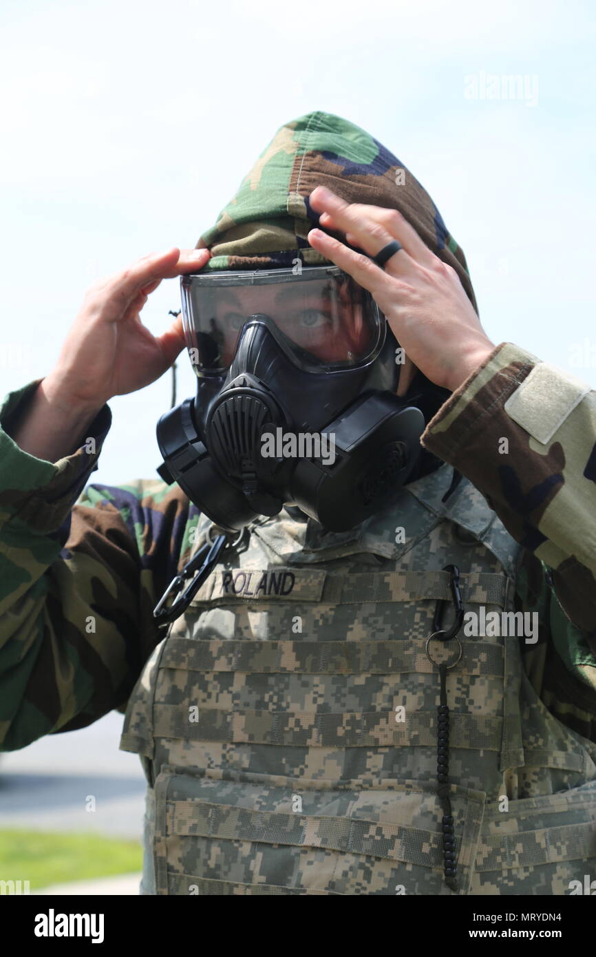 U.S. Army Sgt. Andrew Roland, 71st Ordnance Group (EOD), puts on his ...