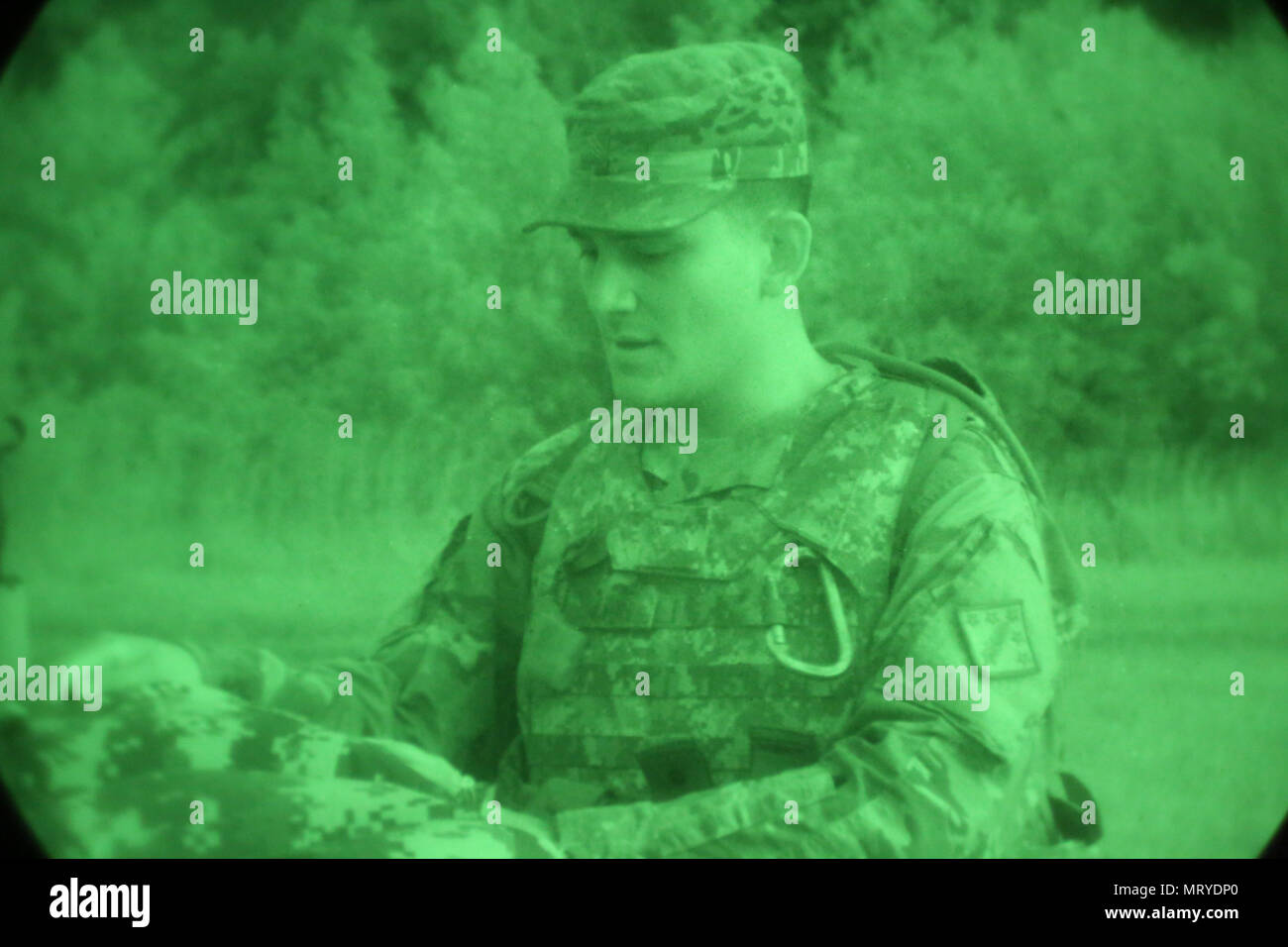 U.S. Army Sgt. Kenneth Blandon, 20th CBRNE Command, stacks sandbags ...