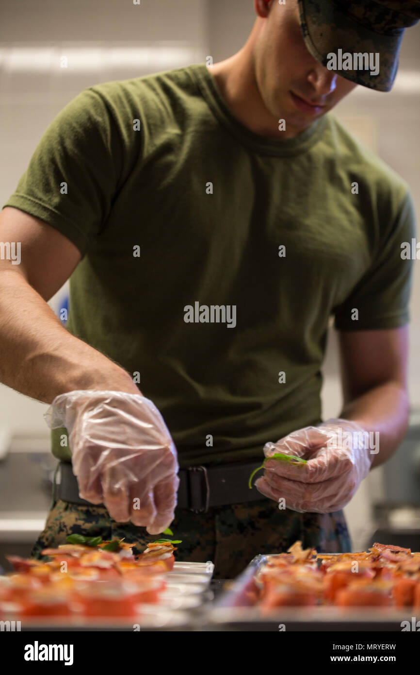 U.S. Marine Corps Pfc. Nicholas Aguilar, a food service specialist with ...