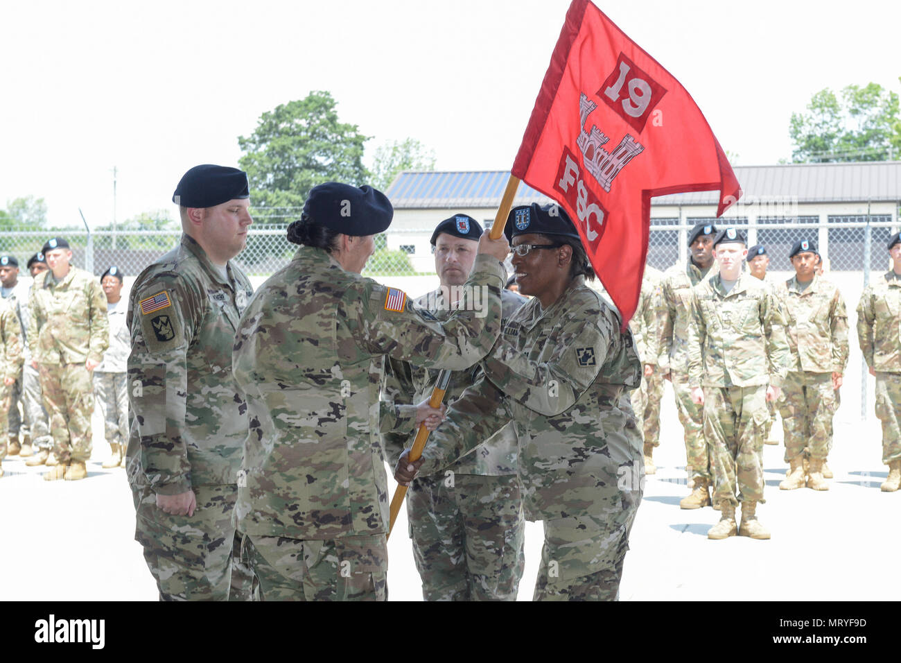 Outgoing Commander CPT Jennifer Williams hands the guidon to LTC Esther ...