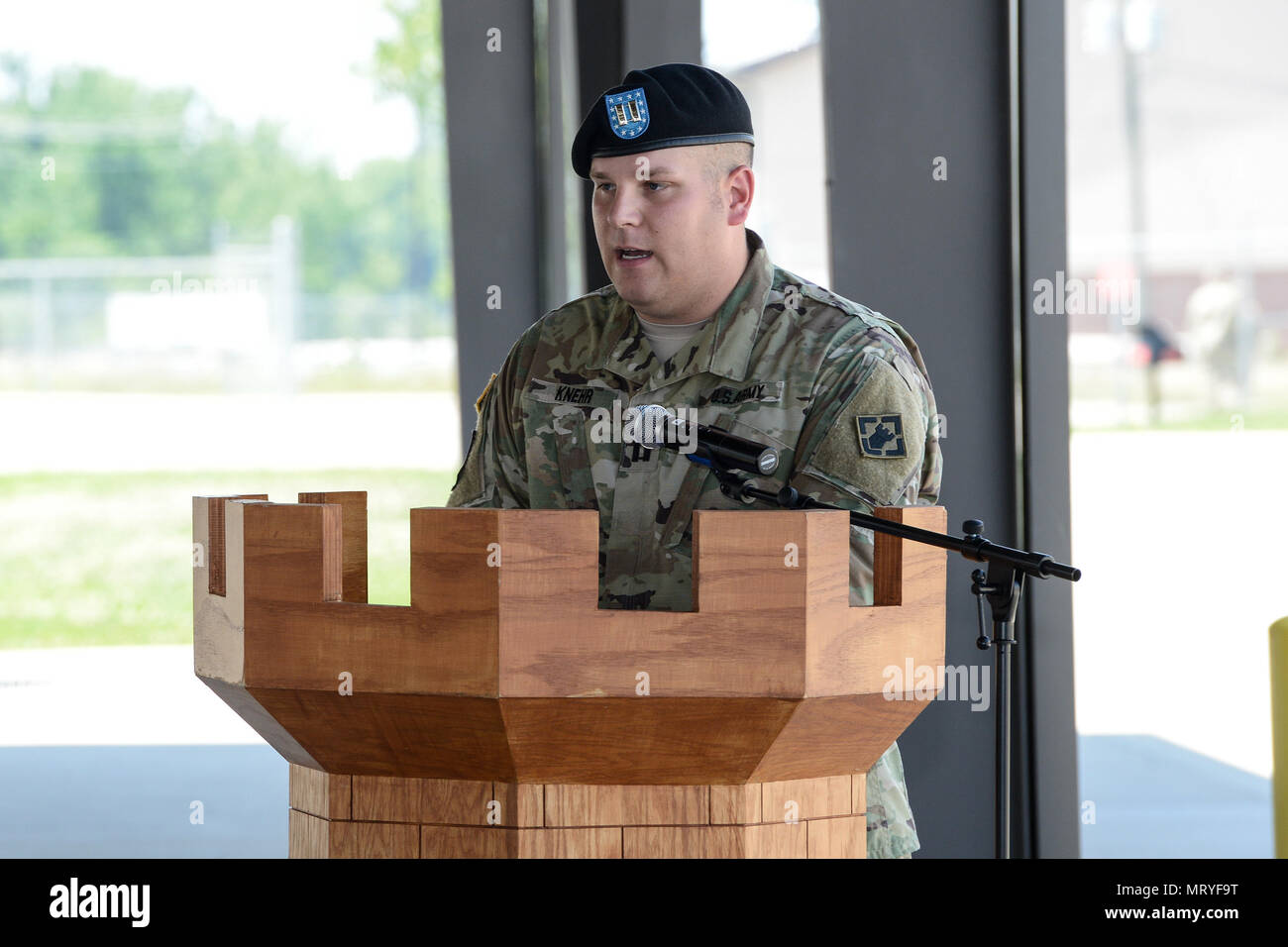 Incoming Commander CPT Dylan Knehr addresses the audience during the ...