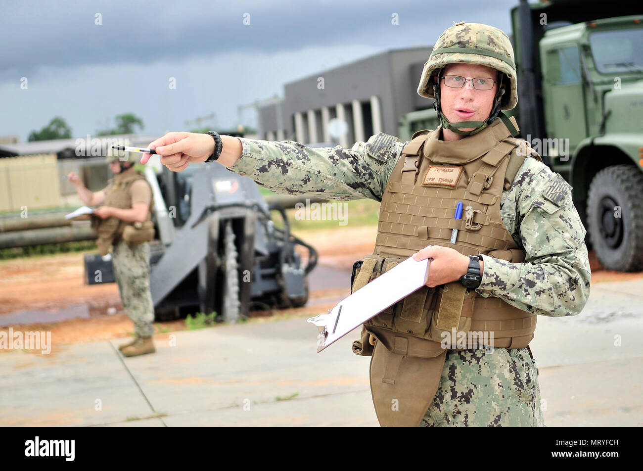 Builder Constructionman Ronald Kunsman, a Seabee assigned to Naval ...