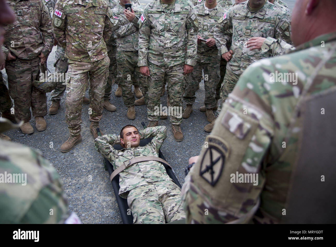A soldier from the Georgian military volunteers as a patient during a ...