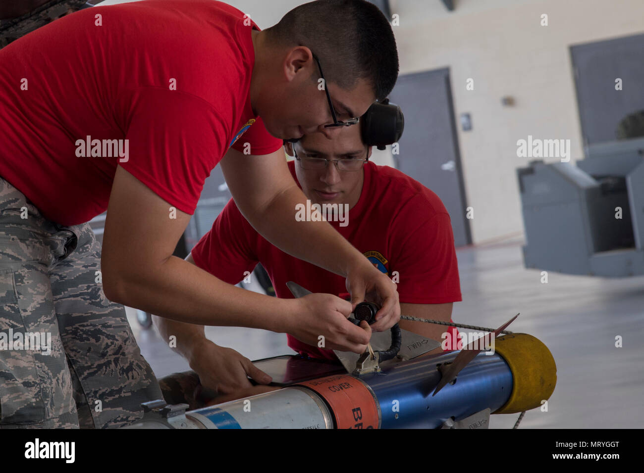 Airman 1st Class Alan Oseguera (left), 75th Aircraft Maintenance Unit ...