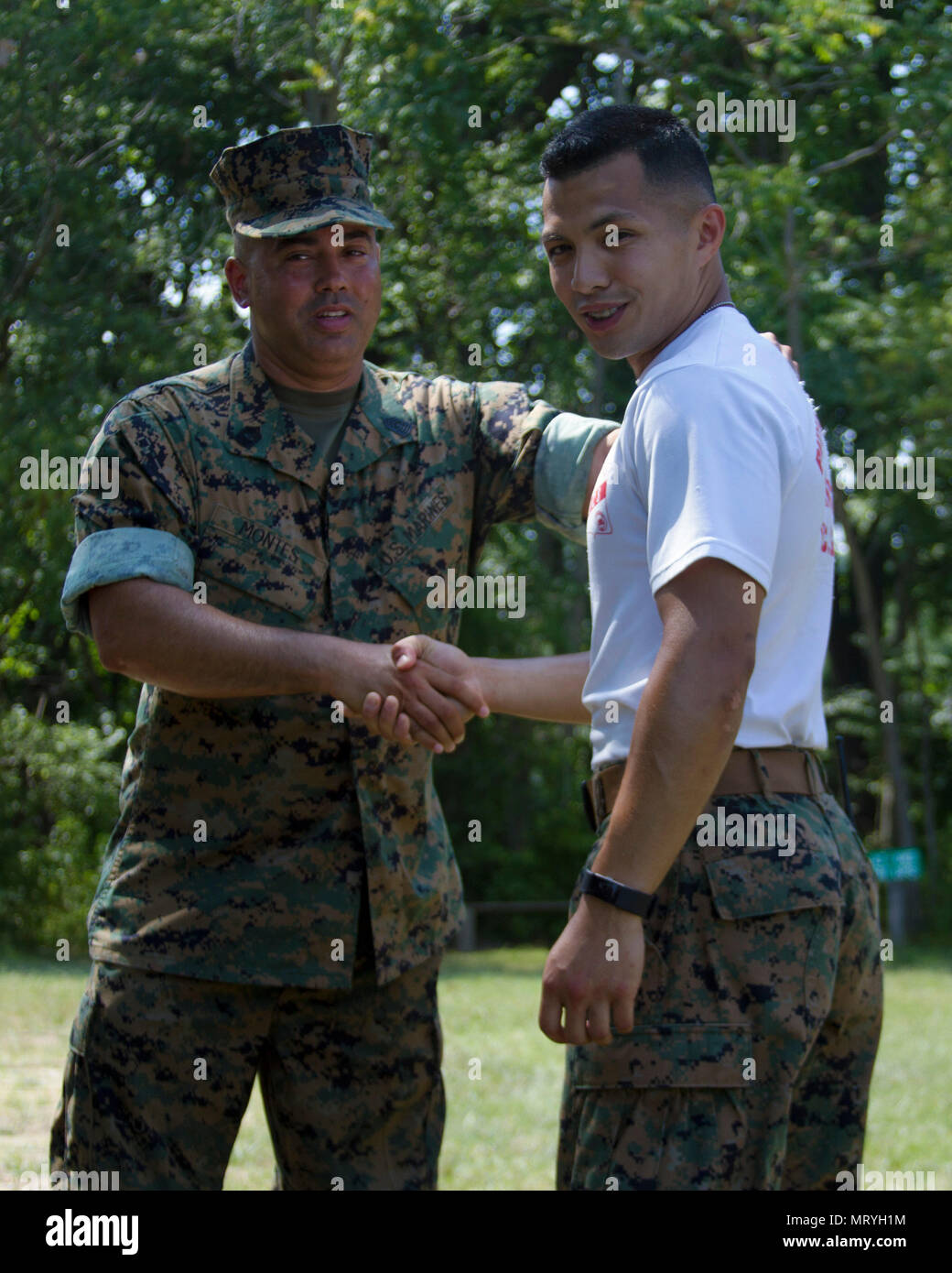 Master Gunnery Sgt. Abuid Montes recognizes a physical training ...