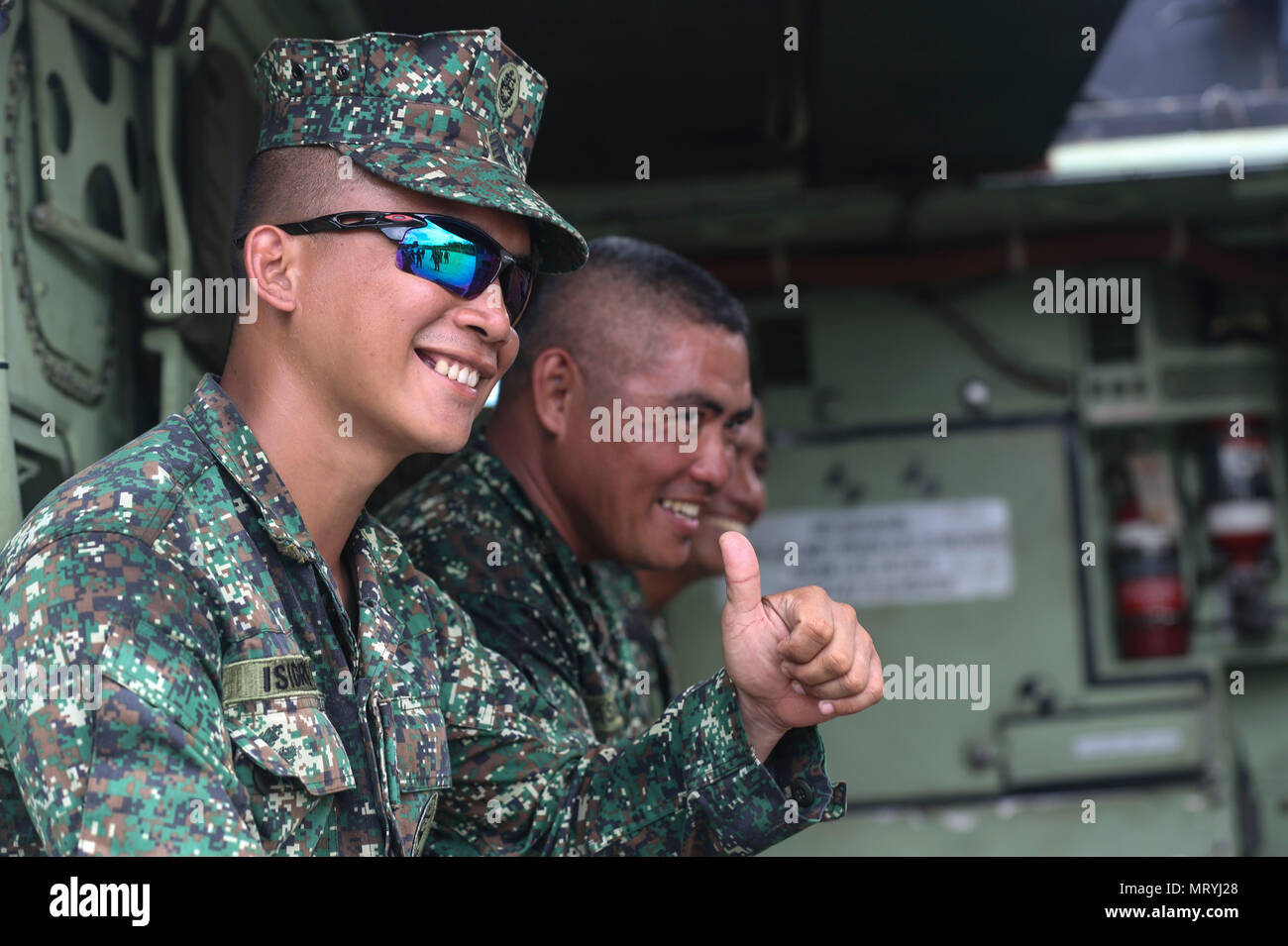 Philippine Marine Sgt. Raymund Isidro signals a thumbs up during egress ...