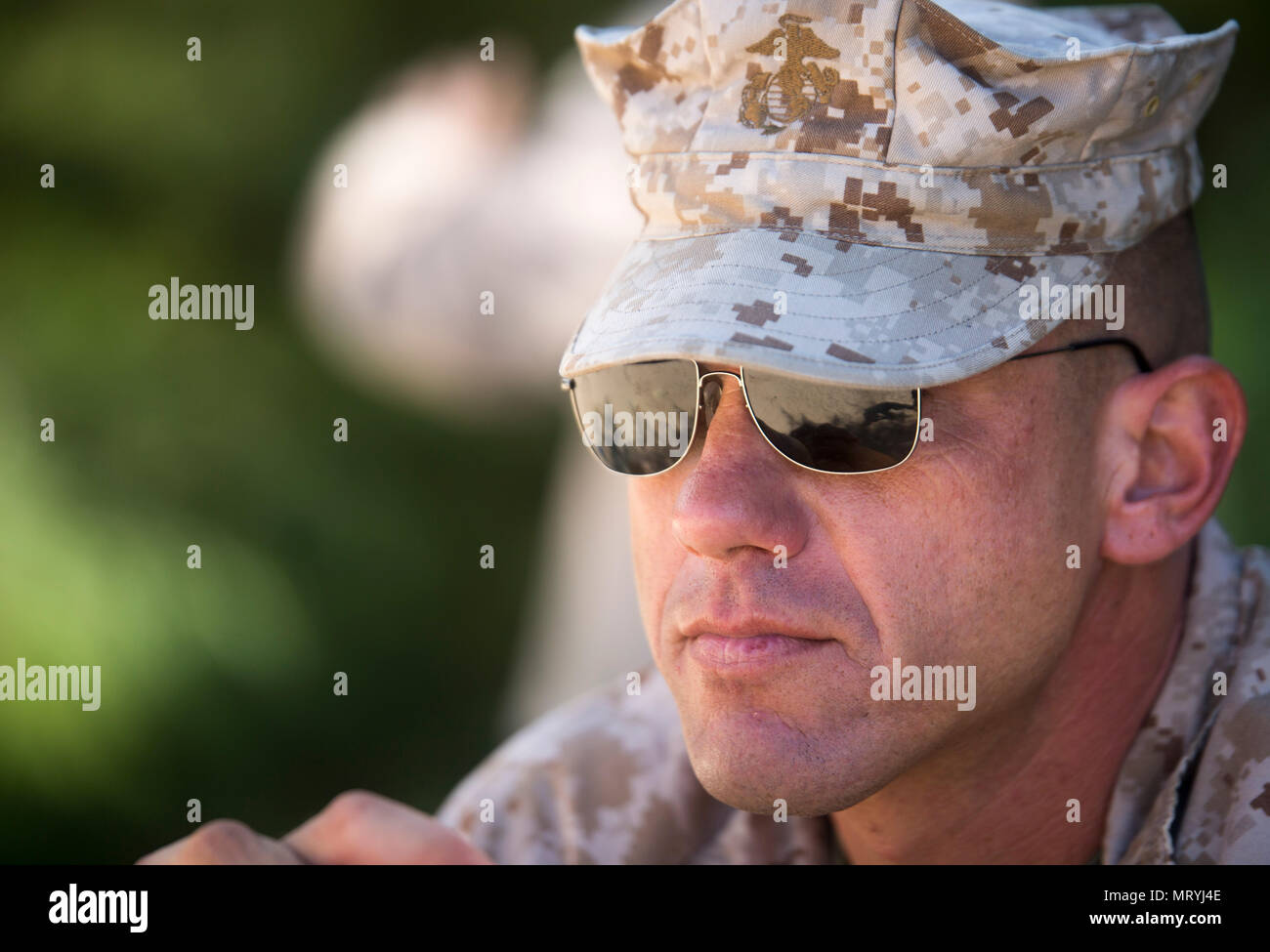 U.S. Marine Gunnery Sgt. Ryan Slusher watches his platoon work with the ...
