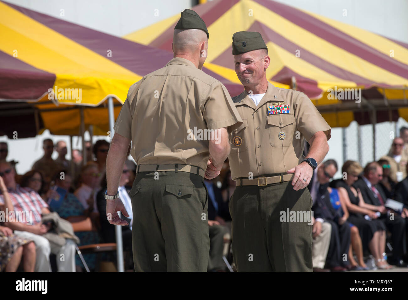 U.S. Marine Corps Col. Brian E. Bufton, left, outgoing commander ...