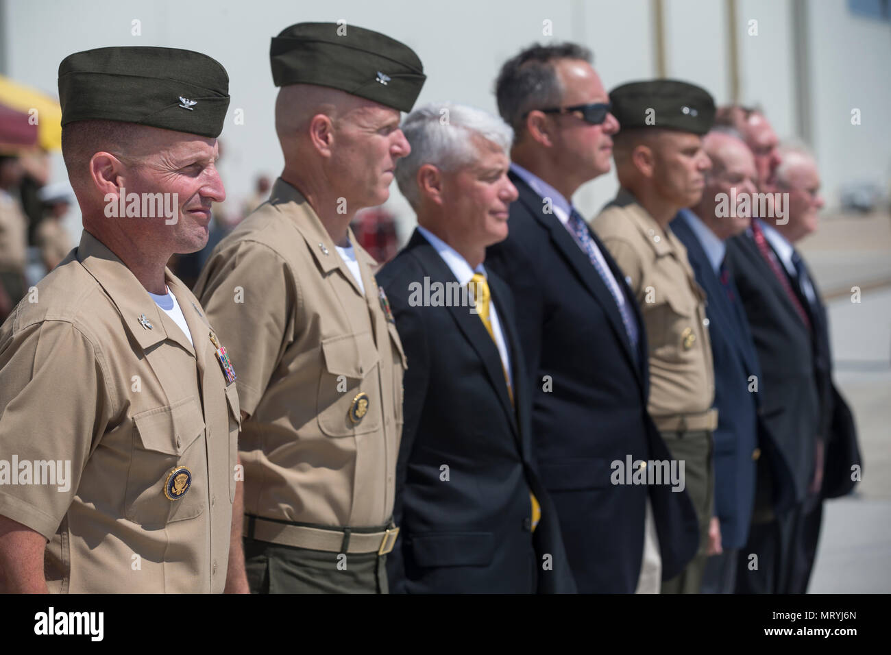 Current and former U.S. Marine squadron commanders stand at attention ...