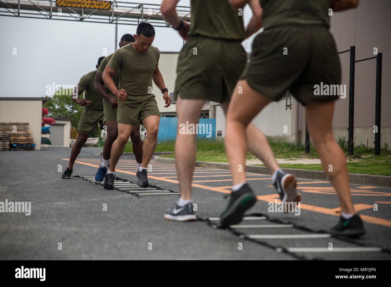 U.S. Marines with Marine Aircraft Group 12 perform an agility drill ...