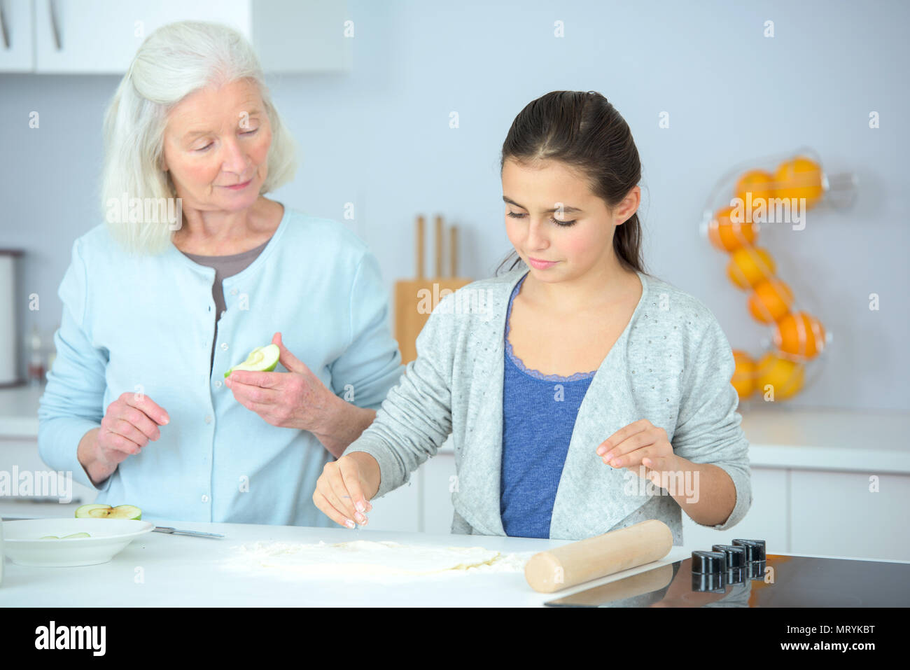 Baking with grandma Stock Photo - Alamy