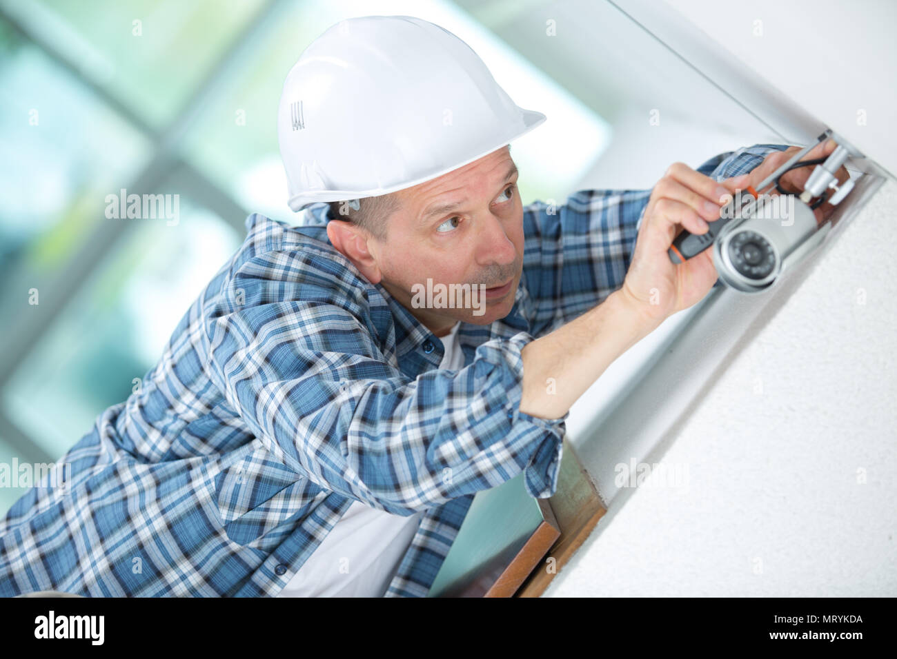 professional cctv technician working Stock Photo - Alamy