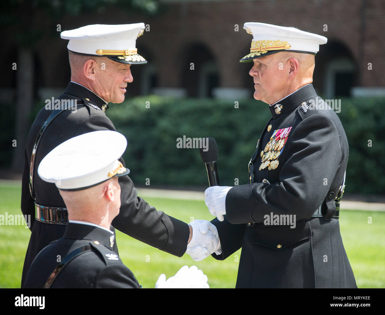 U.S. Marine Corps Gen. Robert B. Neller, right, shakes the hand of Lt ...