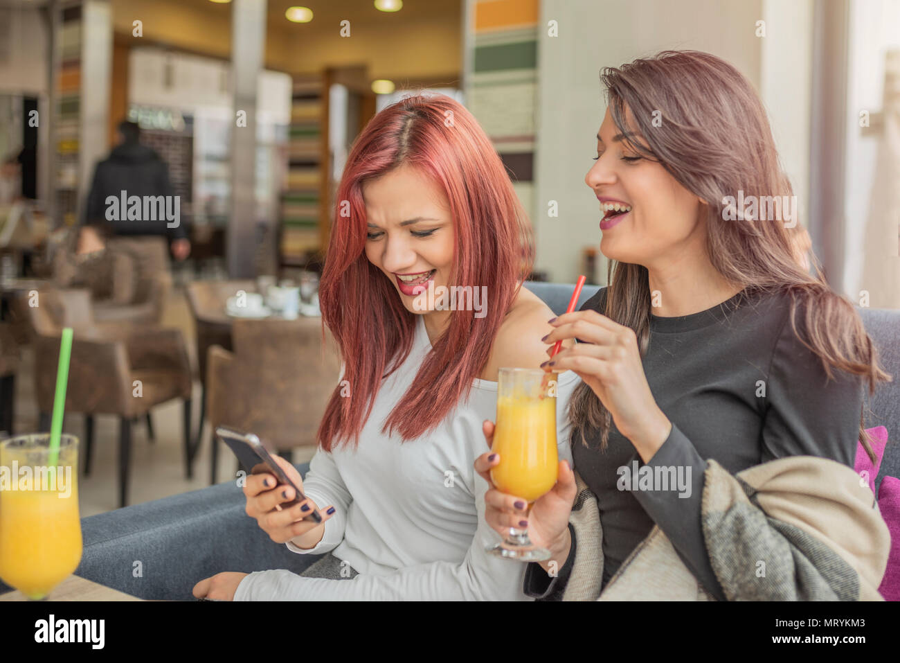 Portrait of two young beautiful girls enjoying together. Two young girl ...