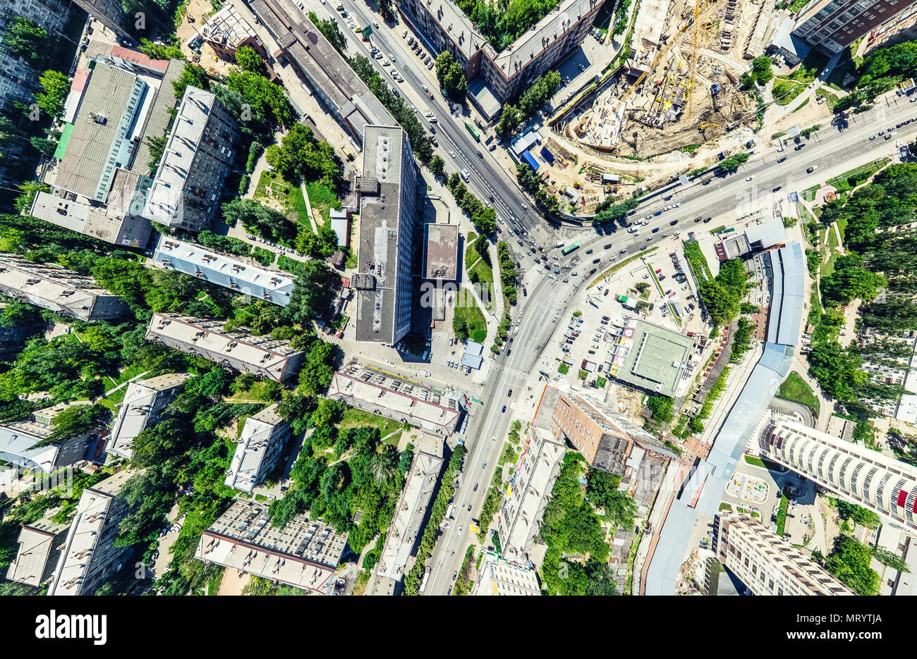 Aerial city view with crossroads and roads, houses, buildings, parks ...