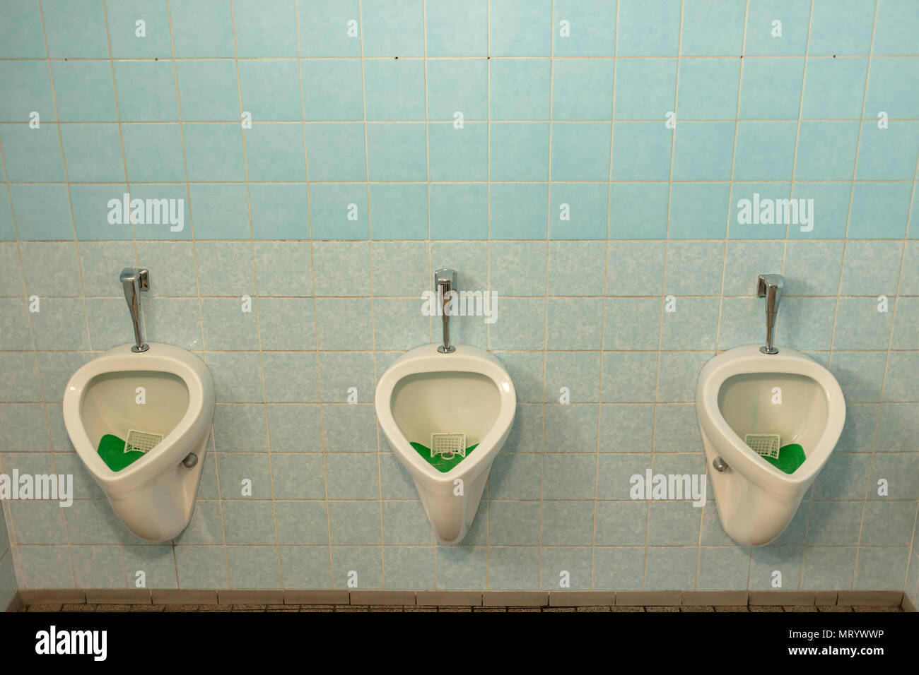 Urinal bowls with soccer / football shoot goasl Stock Photo - Alamy