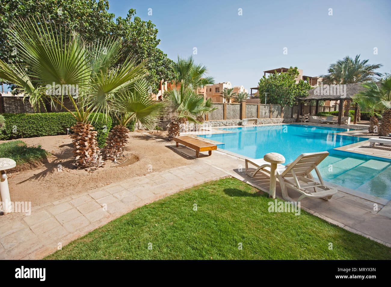 Luxury villa show home in tropical summer holiday resort with swimming ...