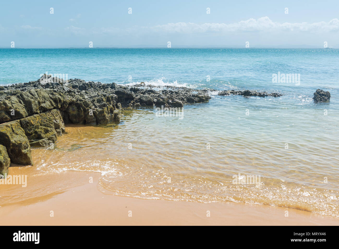 Gritty rocks by the shoreline with small salt water pools Stock Photo ...