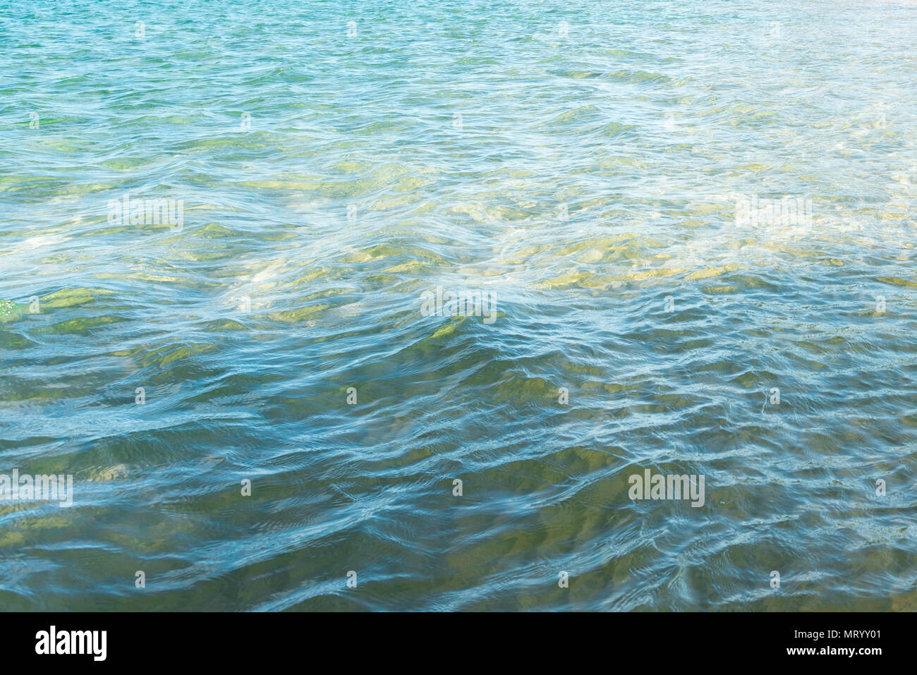 Sea water forms and effects all over the beach Stock Photo - Alamy