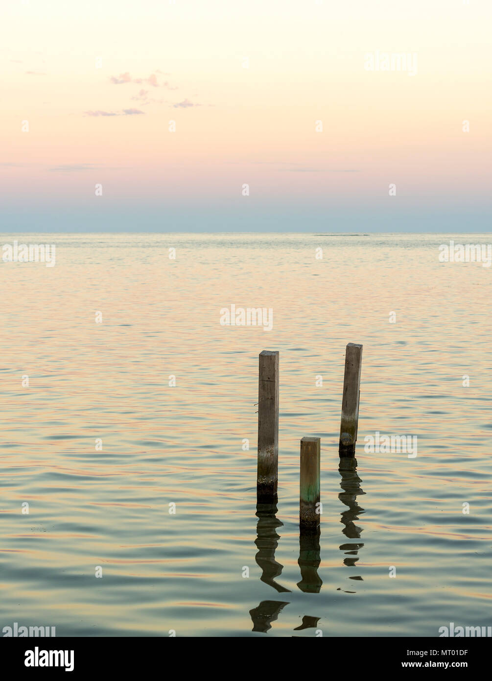 Ocean landscape with minimalism design of wooden pylons Stock Photo - Alamy