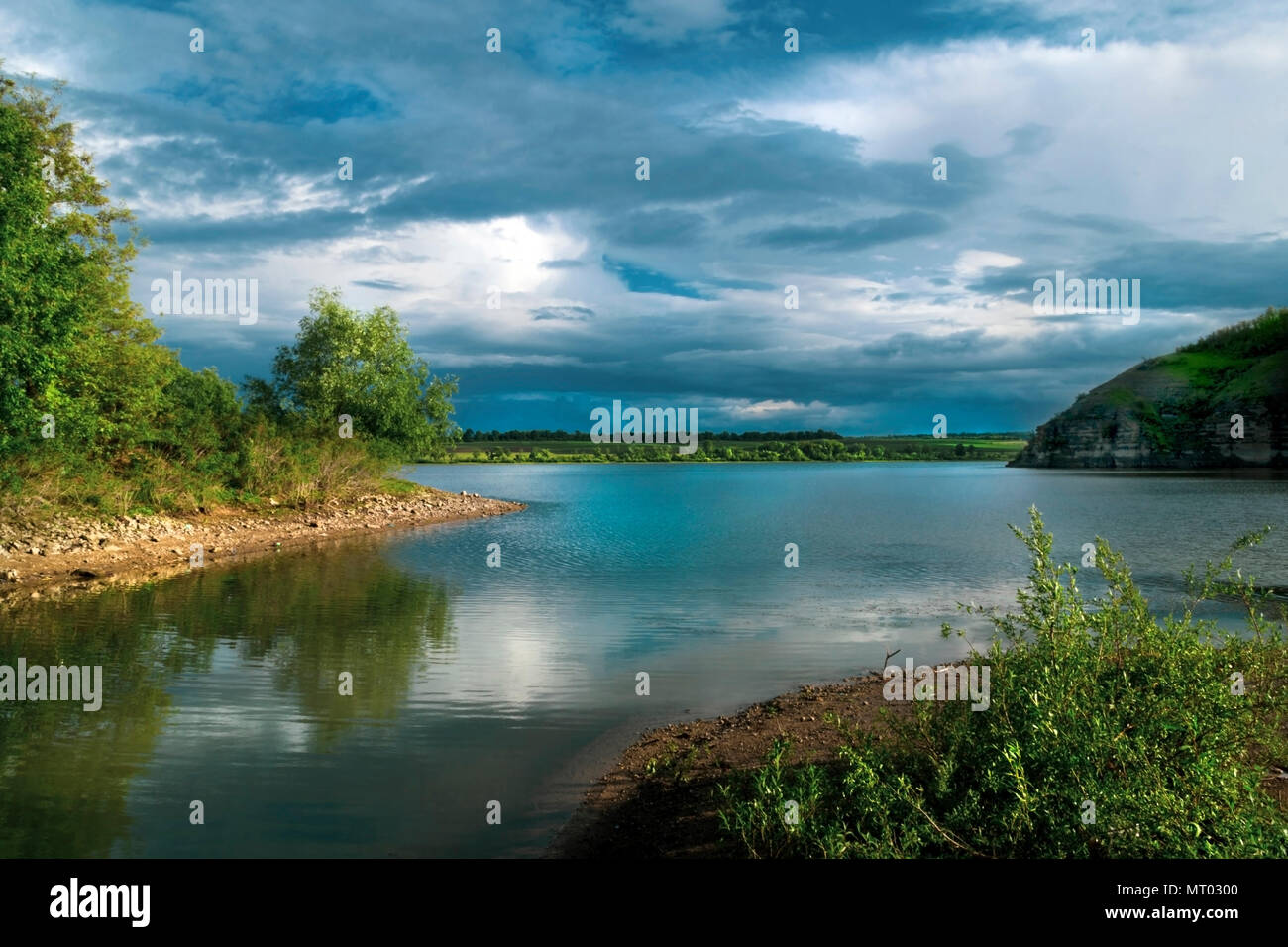 Beautiful river landscape. Calm river with colorful sky reflection on ...