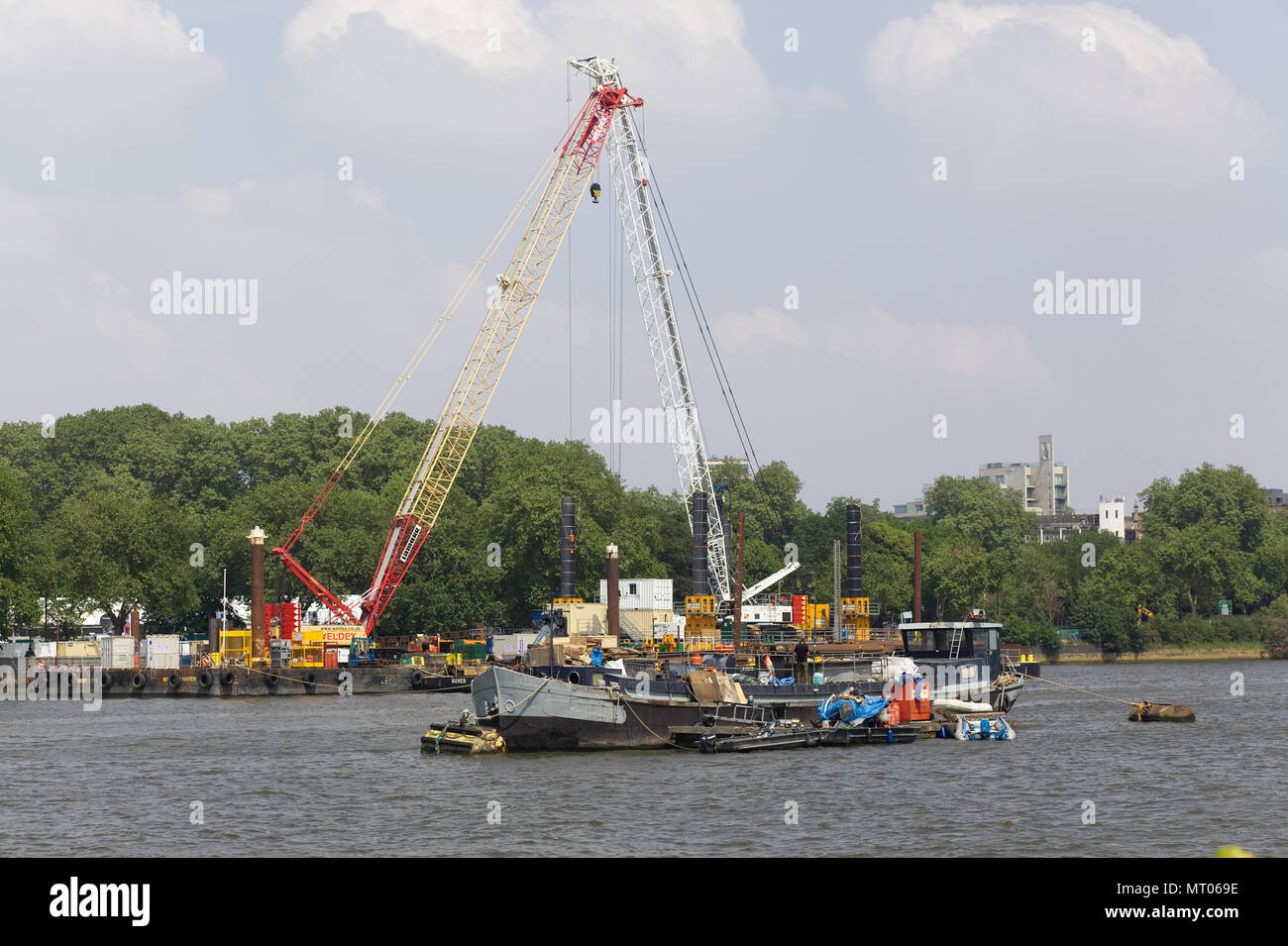 cleaning the river thames with cranes and barges Stock Photo - Alamy