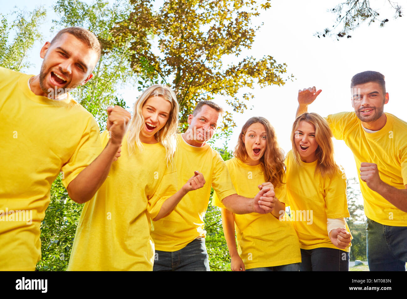 Happy Team celebrates success at teambuilding event in nature Stock ...