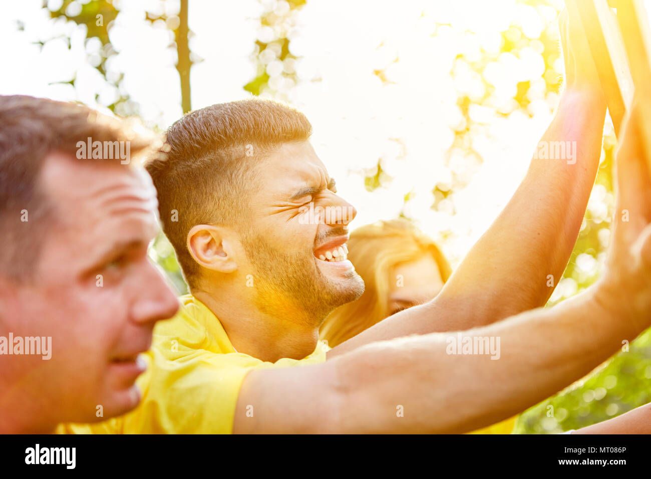 Collaboration in a Teambuilding Team Event in nature Stock Photo - Alamy