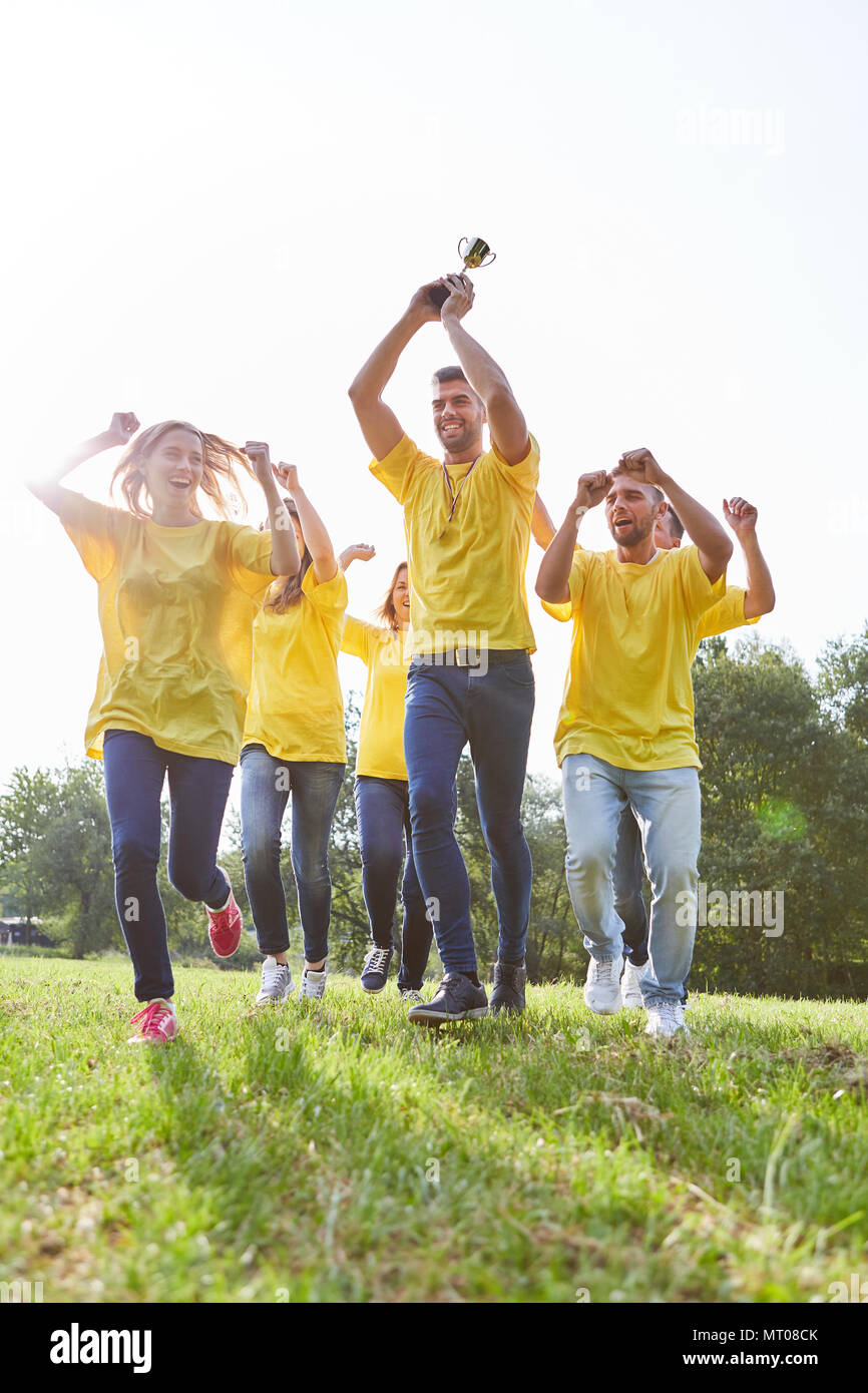 Business people competition man woman run to trophy hi-res stock ...