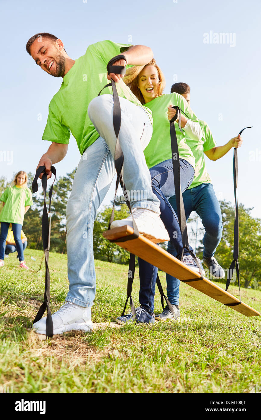 Young sporty team is having fun doing an exercise for coordination and teamwork Stock Photo - Alamy
