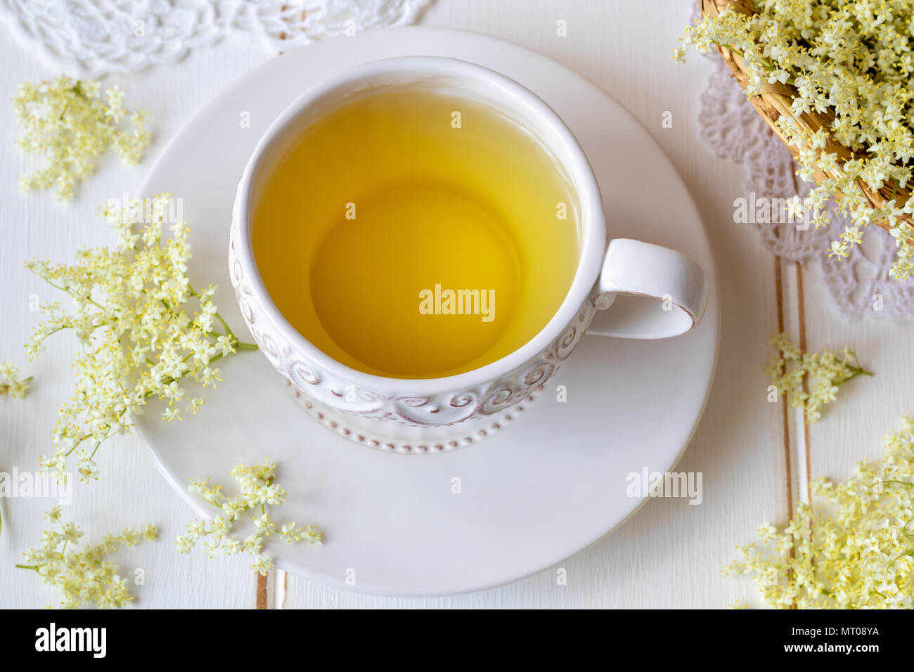 A cup of herbal tea with fresh elder flowers on a white table Stock ...