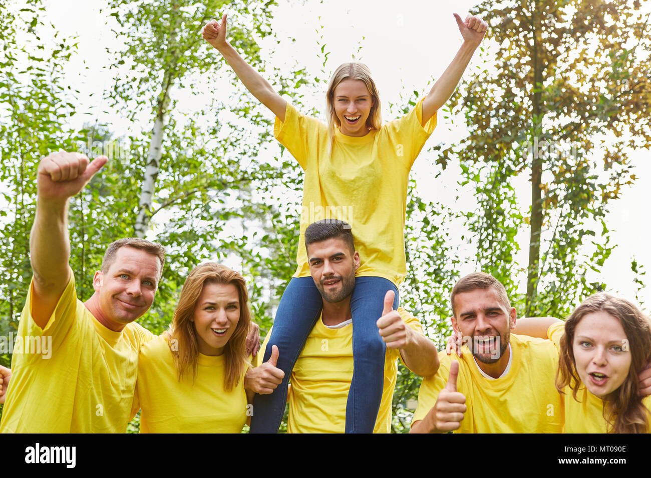 Young people as winners team cheer at a team building event Stock Photo ...