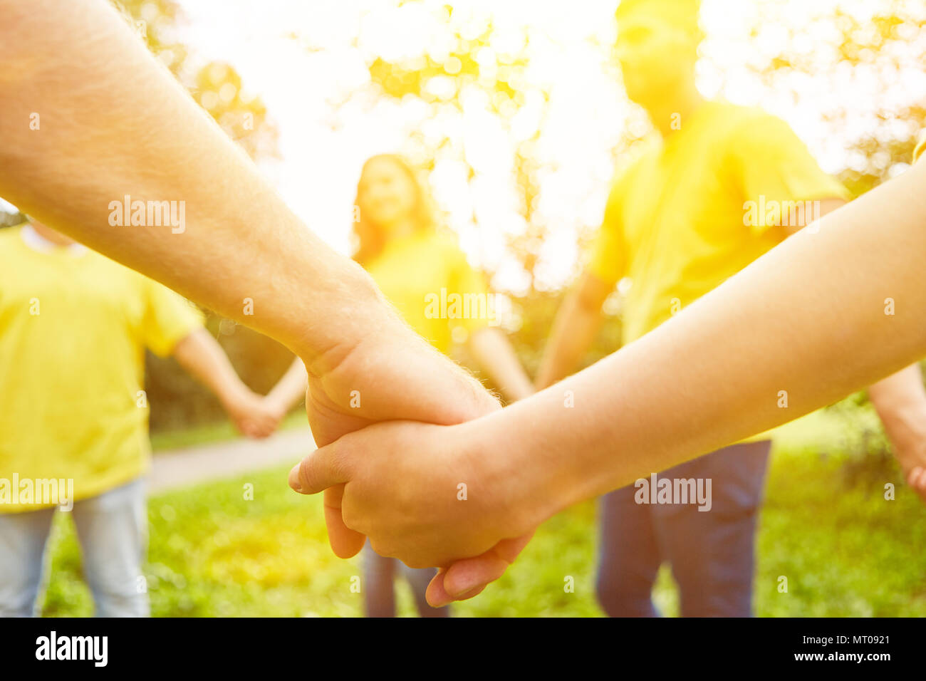 Holding hands circle hi-res stock photography and images - Alamy