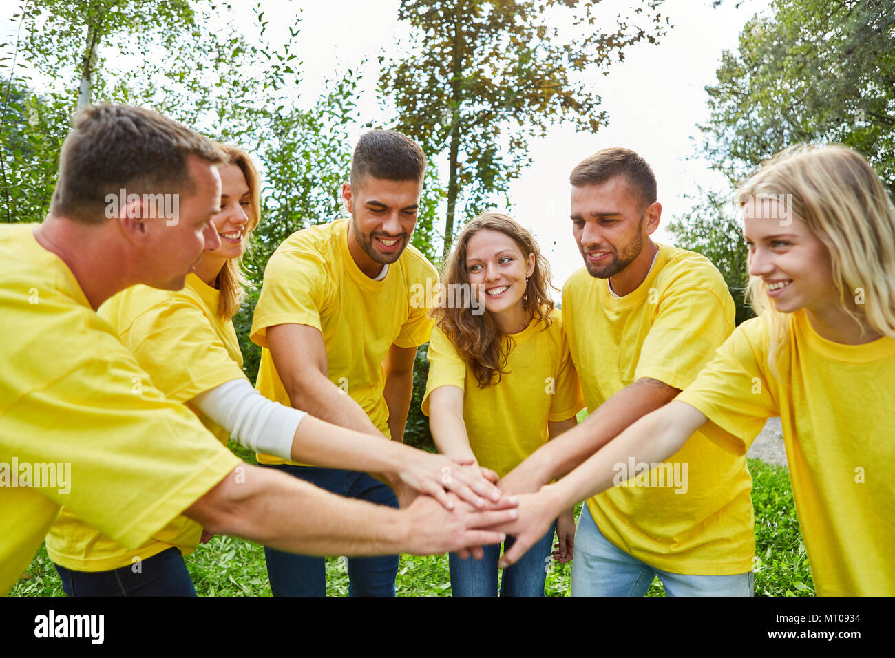 Hands in pile hi-res stock photography and images - Alamy