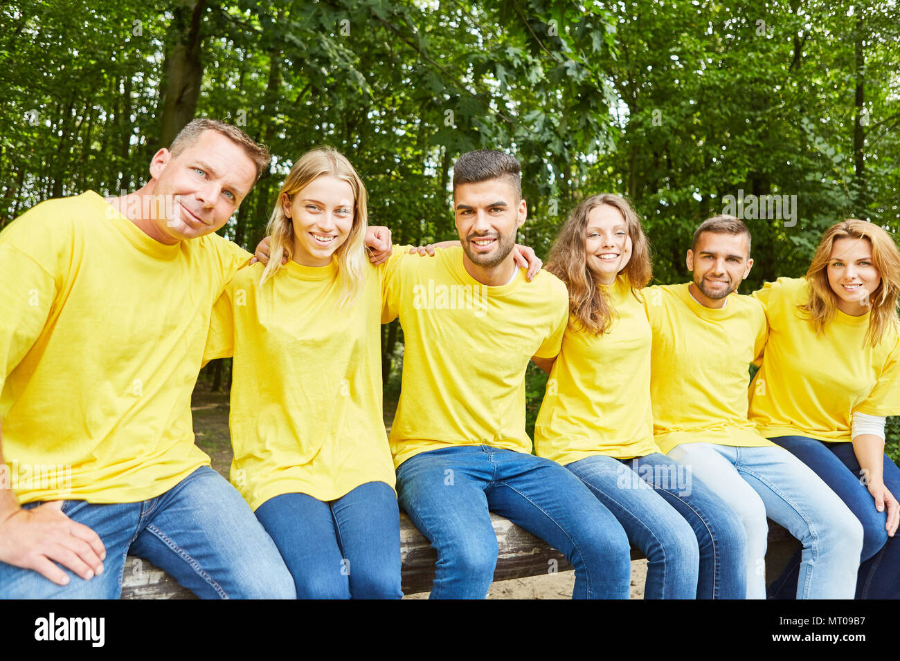 Group of young people as a team and as friends at a teambuilding event ...