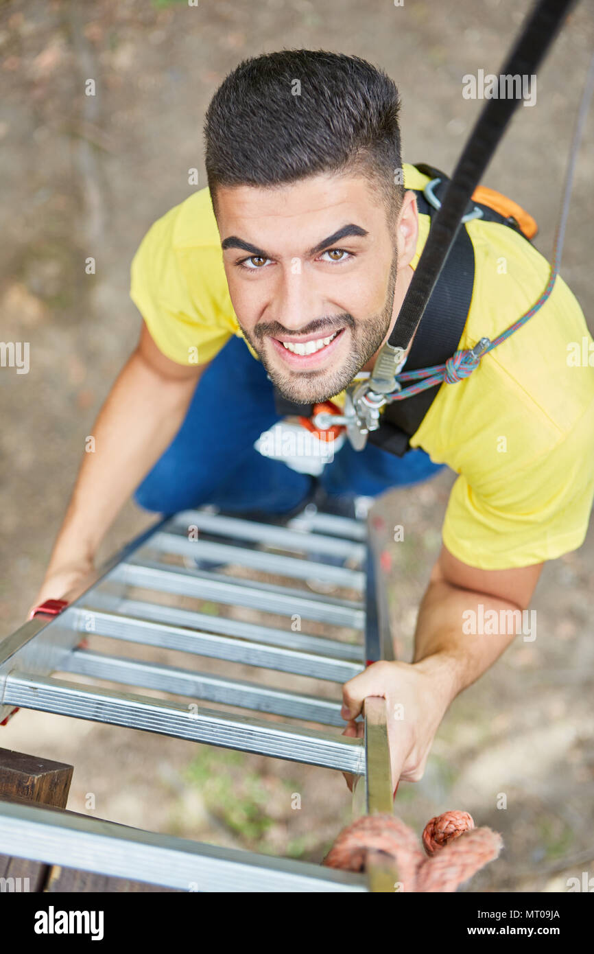 Man climbing up a ladder hi-res stock photography and images - Alamy